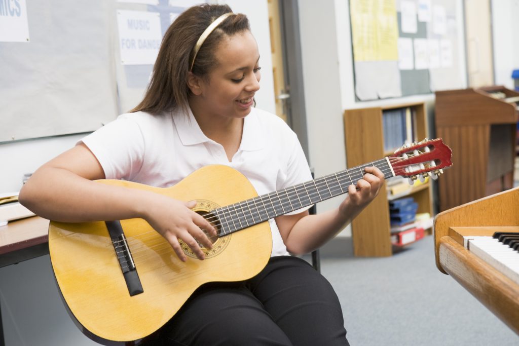 Newsroom | In the News: ‘Guitar heroes’ answer a teacher’s call